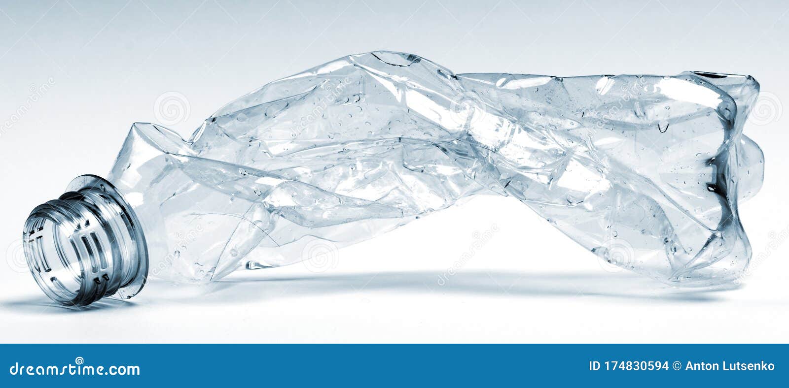 Crashed Plastic Bottles On Blue Background. Recycling Plastic ...