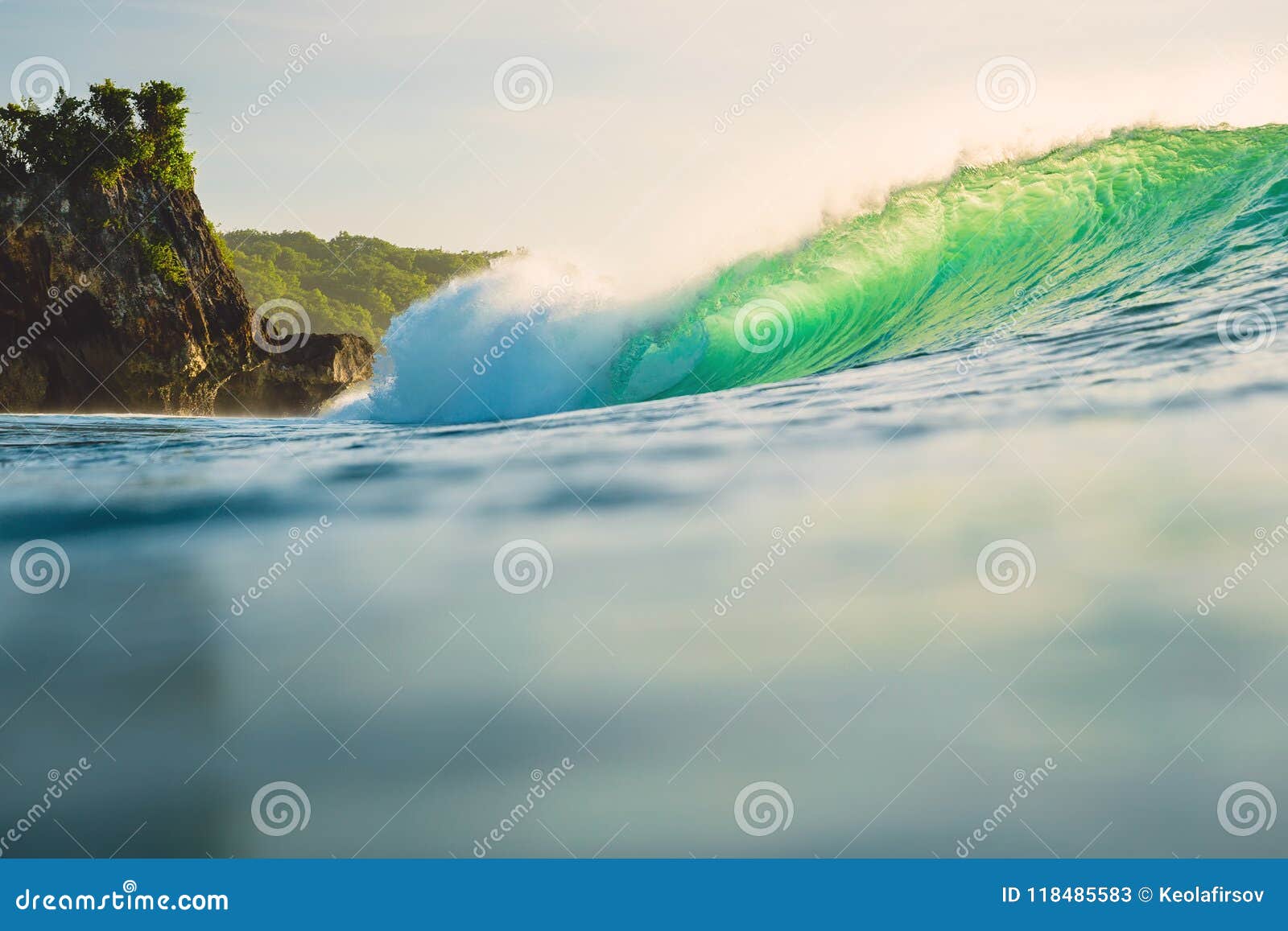 Crashing Ocean Wave. Breaking Green Barrel Wave with Sunset Light Stock ...