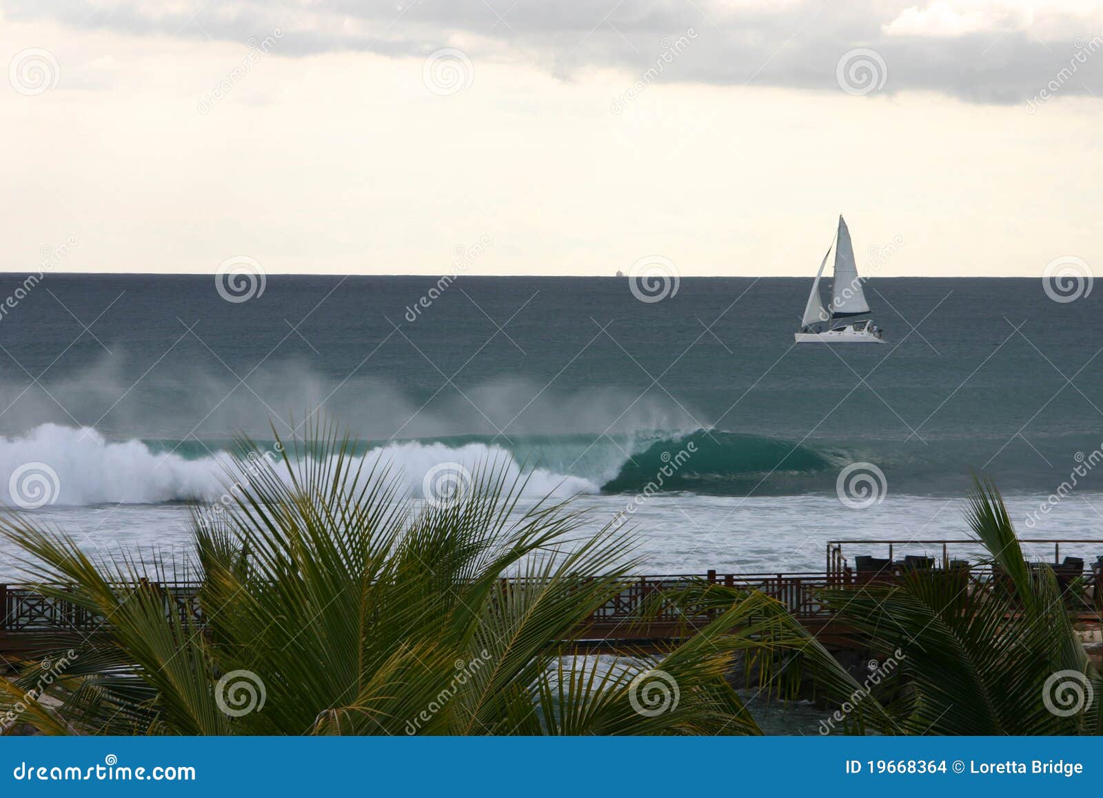 Crashing Waves with Sail Boat Stock Photo - Image of boat, blue: 19668364