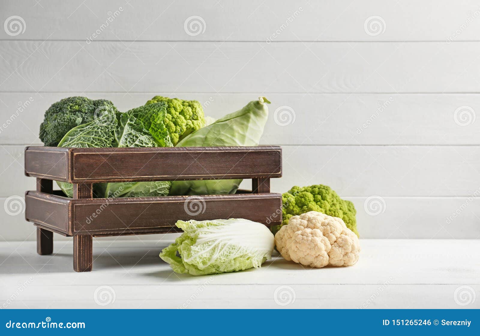 Crate with Different Kinds of Cabbage on White Table Stock Photo ...