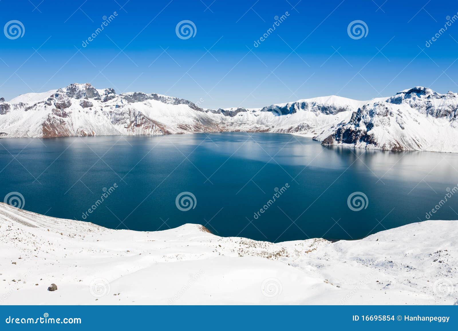 Crater Lake and Snow Mountain Stock Photo - Image of surface, lake ...