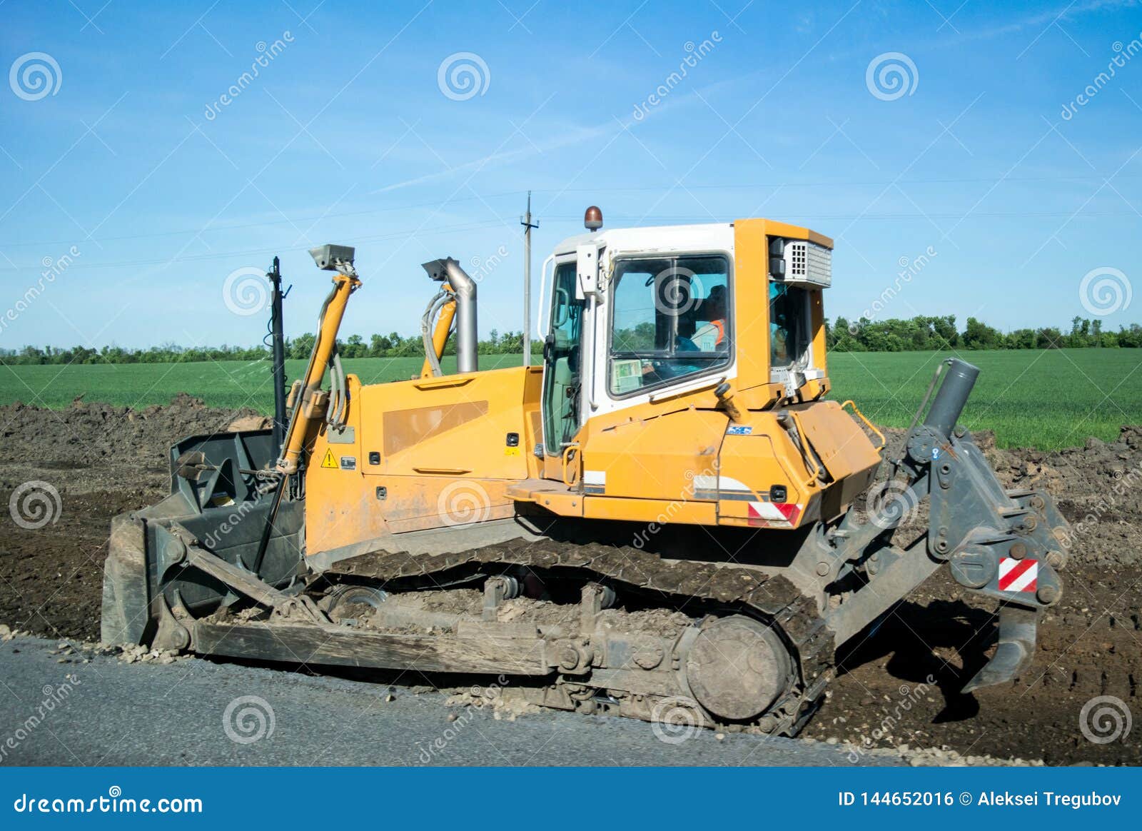 Crawler Bulldozer at Work To Expand the Roadway. Side View, Close Stock ...