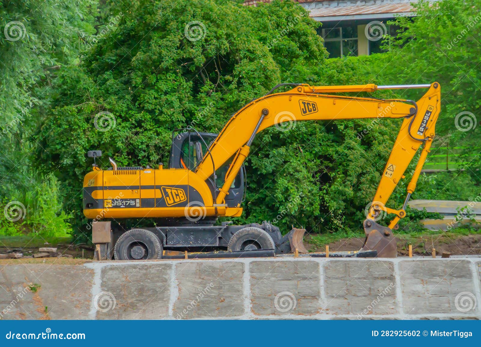 Crawler Excavator Front View Digging on Demolition Site in Backlight ...