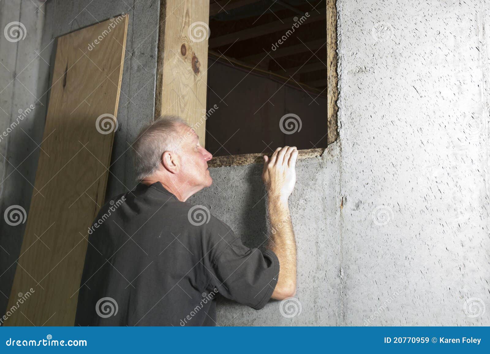 Crawl Space Under The Eves Of A House Showing Old Fibreglass Insulation ...
