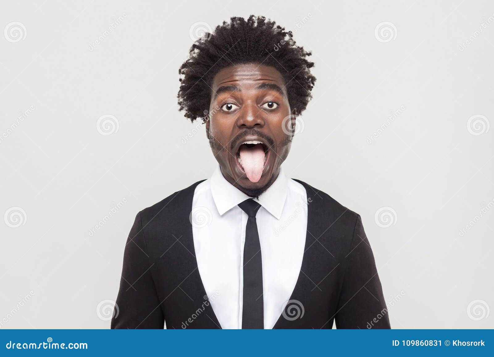 Crazy Afro Man Looking at Camera and Tongue Out. Stock Image - Image of ...