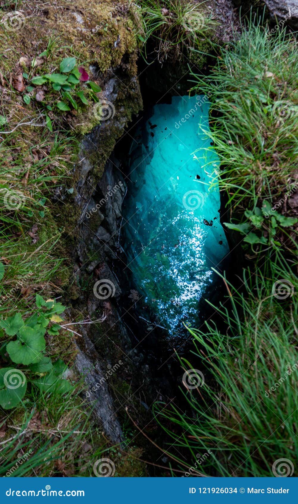 Blue Water Cave Floatet with Light Blue Watter, Swiss Alps Stock Photo ...