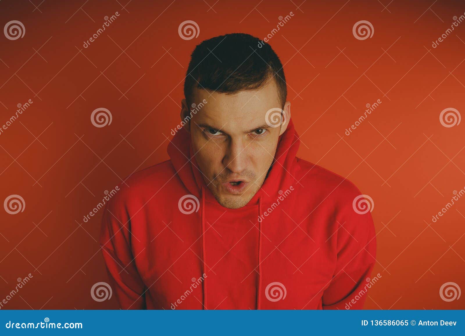 Crazy and Charismatic Guy Posing on an Orange Background. a Man in a ...