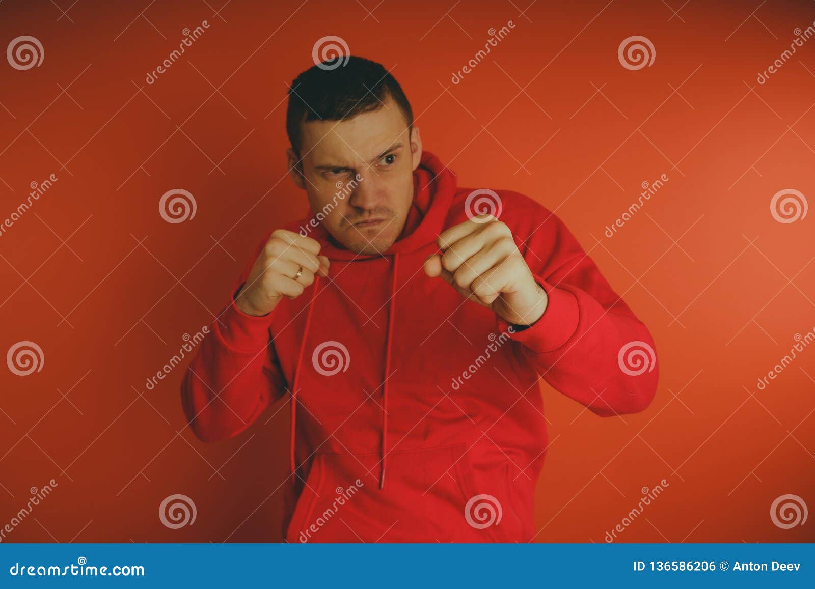 Crazy and Charismatic Guy Posing on an Orange Background. a Man in a ...