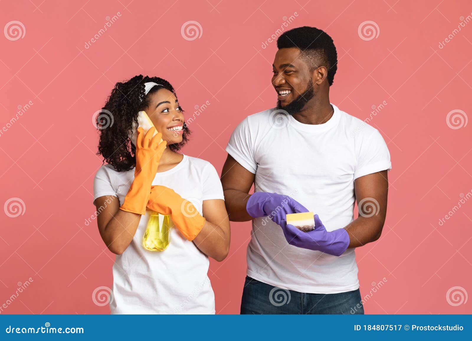 Crazy Cleaning. Joyful Couple Using Sponges Like Cellphones, Having Fun ... Crazy Cleaning. Joyful Couple Using Sponges Like Cellphones, Having Fun ...