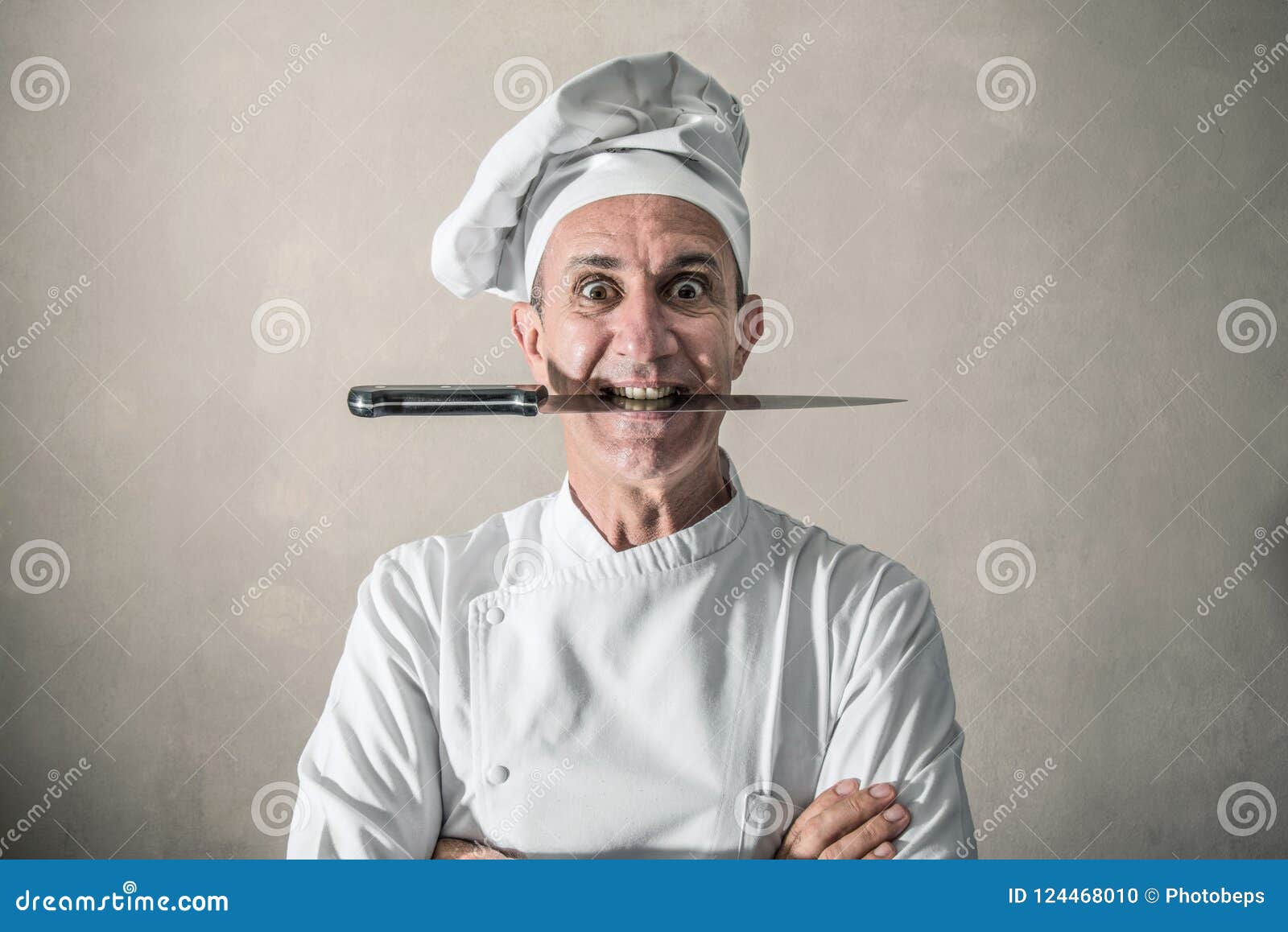 Crazy Cook with the Knife between the Teeth Stock Photo - Image of ...
