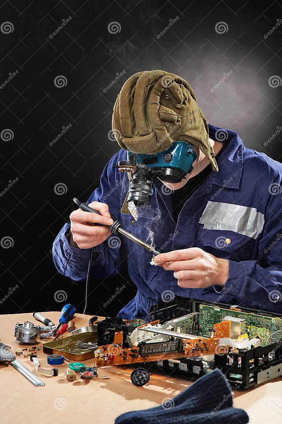 Crazy Genious Witth Soldering Iron Stock Image - Image of magnifying ...