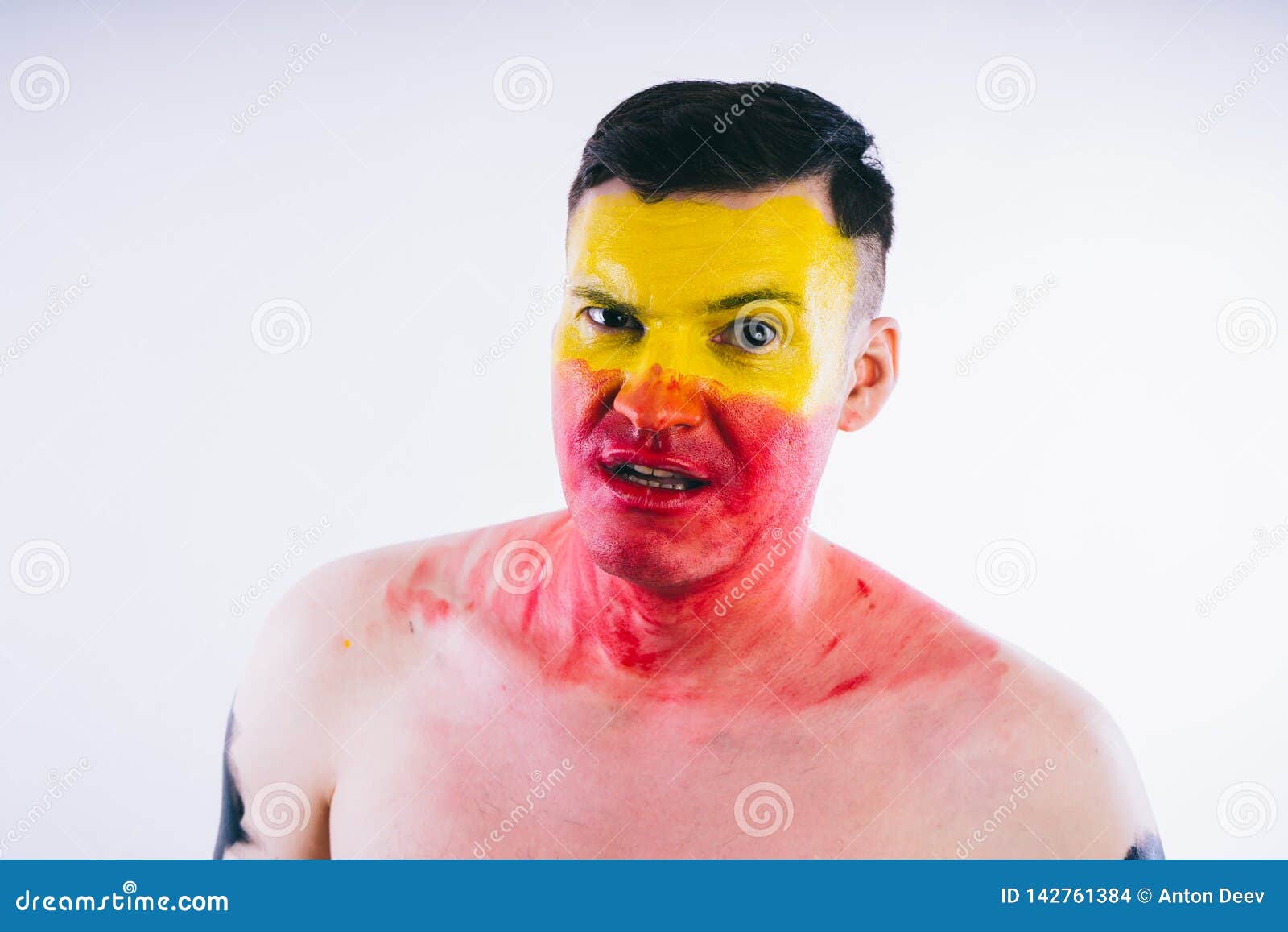 Crazy Guy Posing with a Painted Face. a Bizarre Portrait of a Man with ...