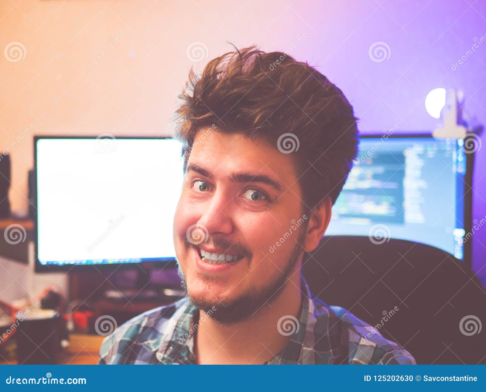 Crazy Looking Nerdy Smiling Man Developer Freelancer with Two Monitors ... Crazy Looking Nerdy Smiling Man Developer Freelancer with Two Monitors ...