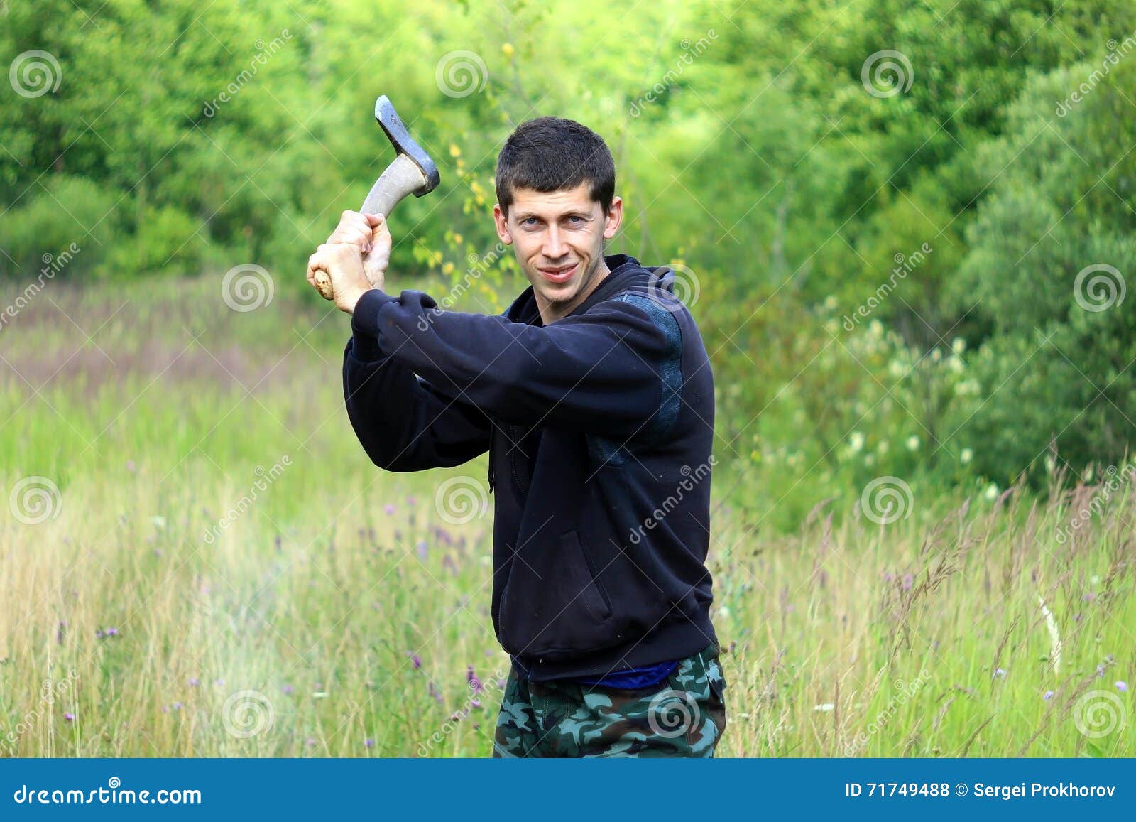 Crazy man with an axe stock photo. Image of waving, wild - 71749488
