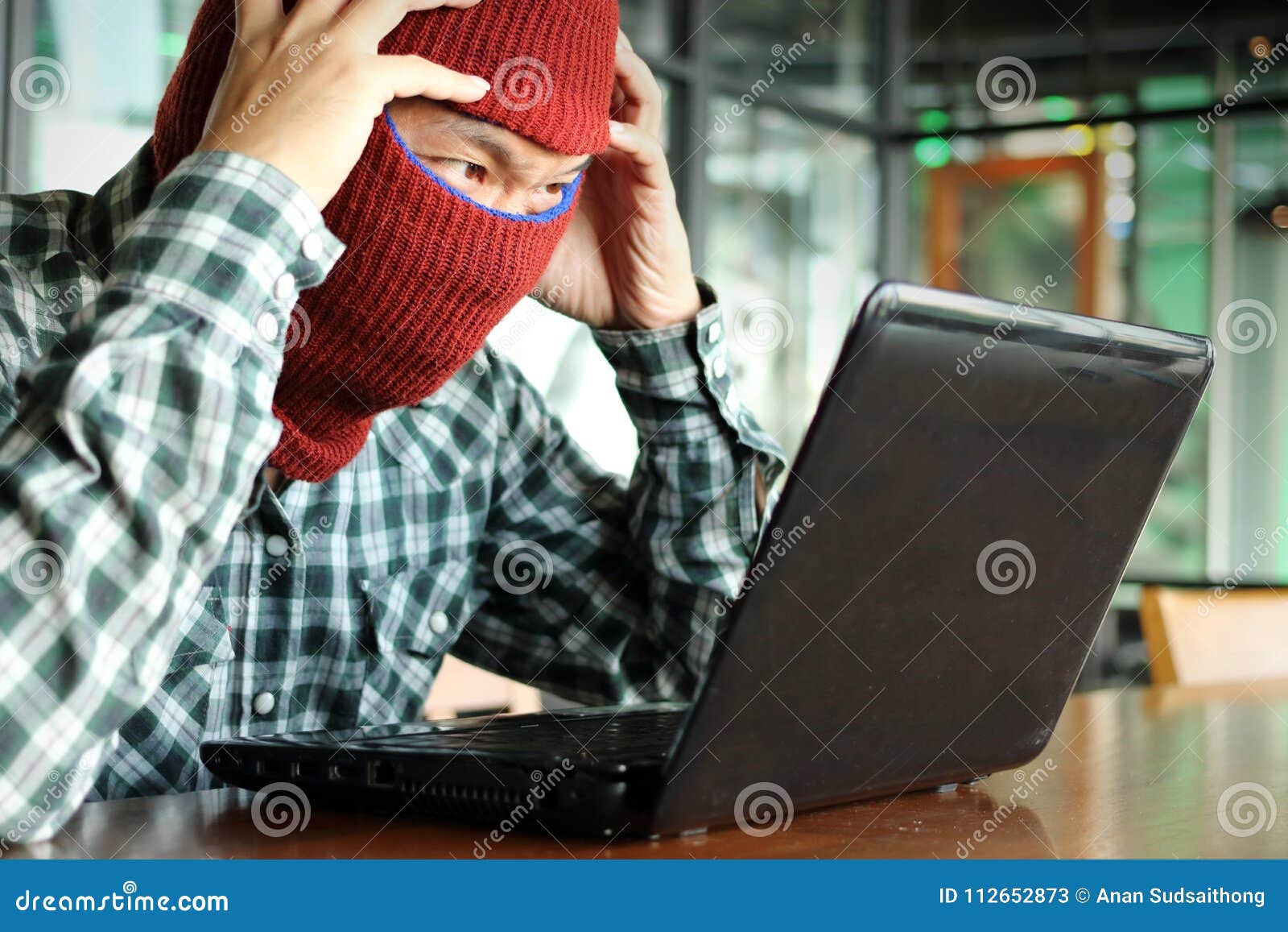 Crazy Masked Hacker Wearing a Balaclava Touching on Head between ...