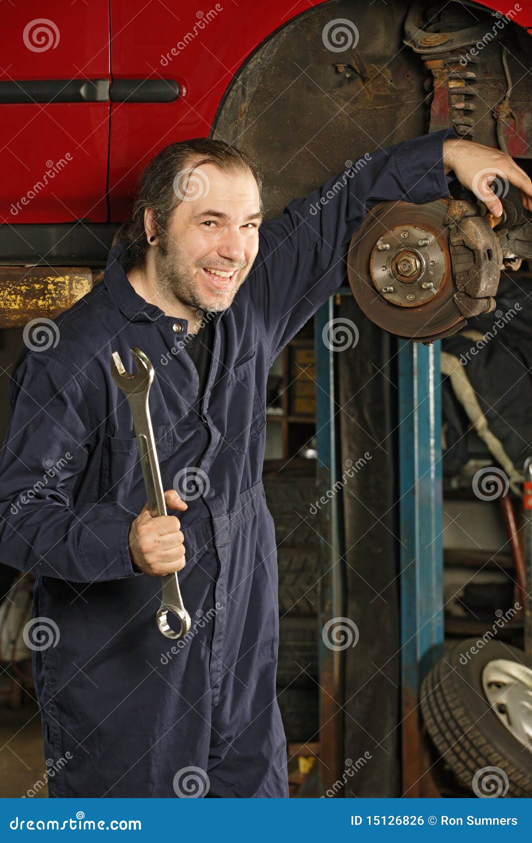Crazy Mechanic Fixing the Brakes Stock Photo - Image of repairman ...