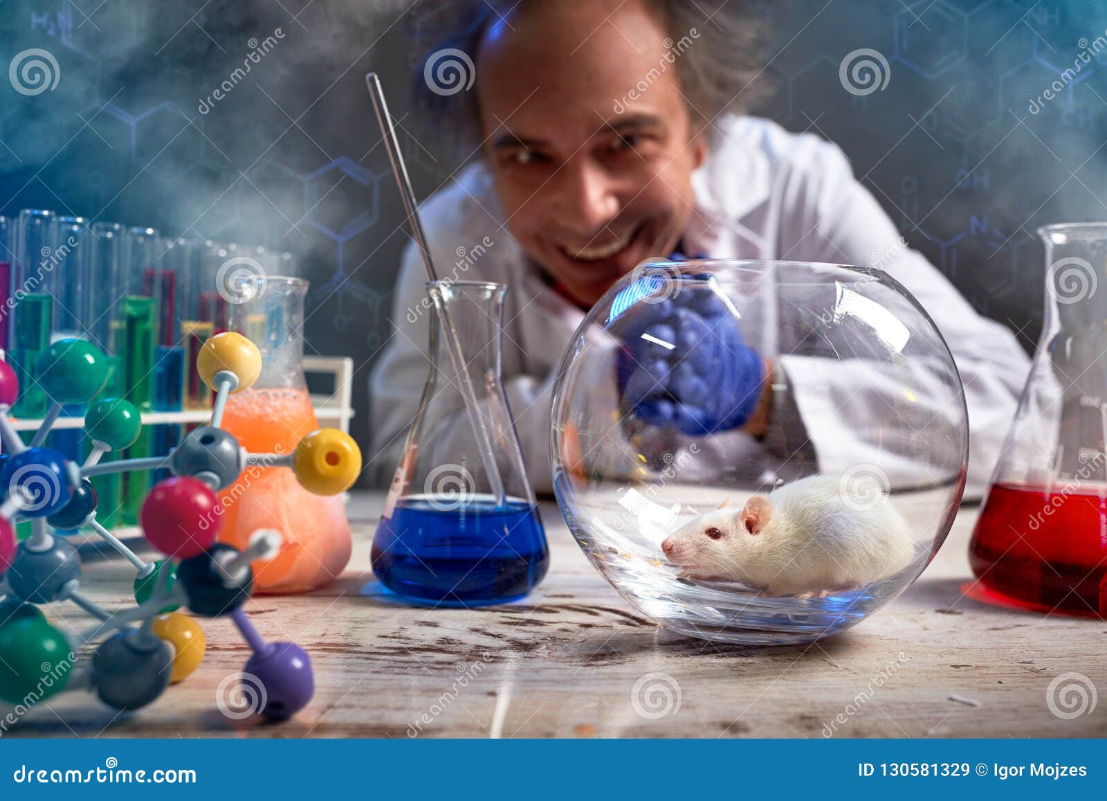 Crazy Scientist With Goofy Look Grabbing Glass Test Tubes Sitting In ...