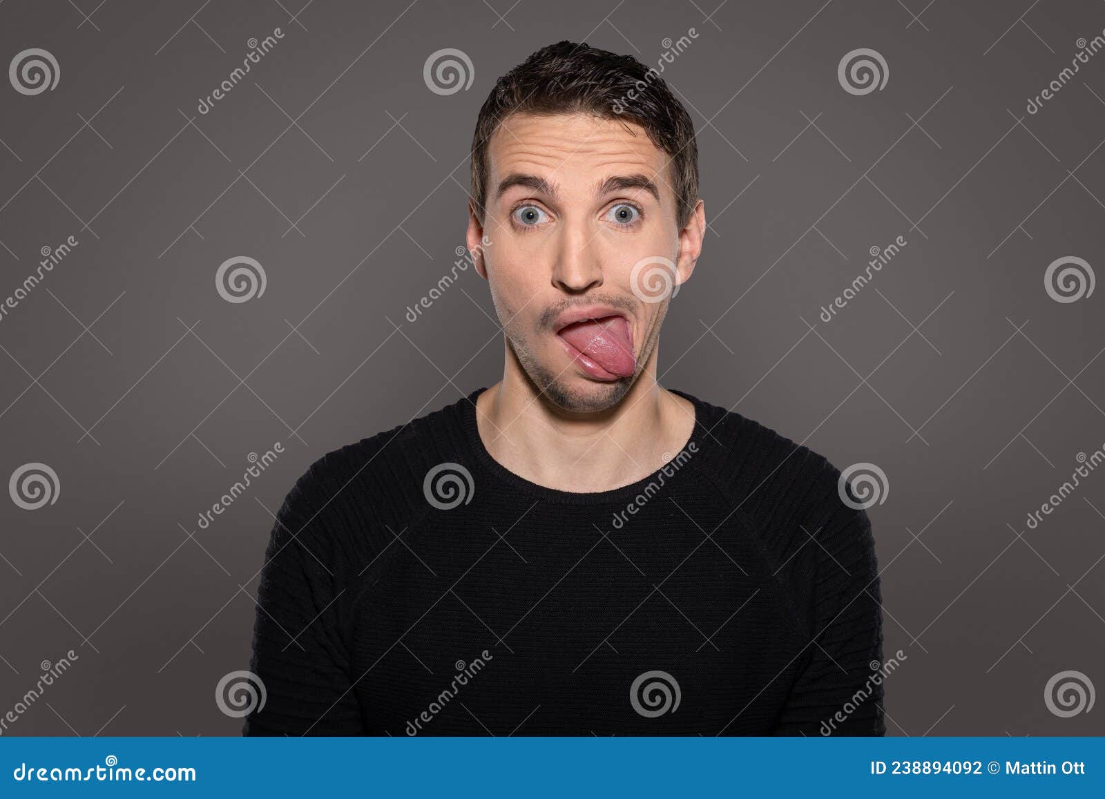 Crazy Smiling Man Having Fun While Show His Tongue And Having A