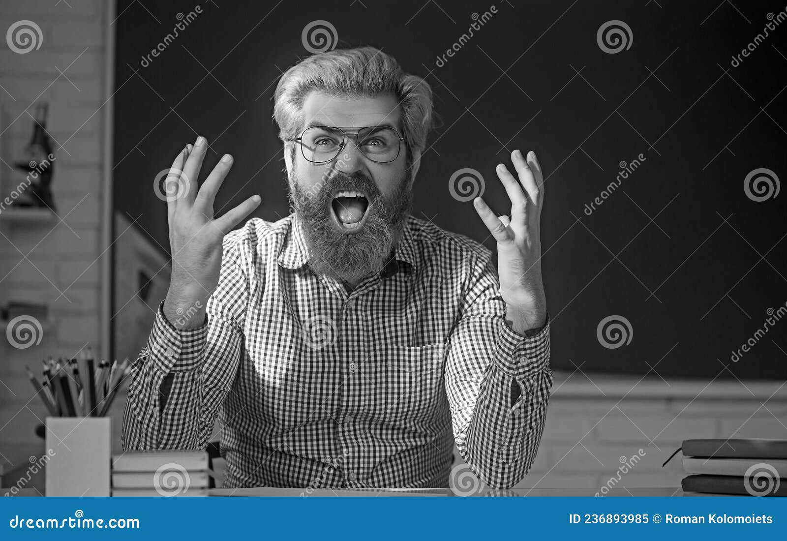 Crazy Teacher In The Classroom On Blackboard Background. Senior Teacher ...