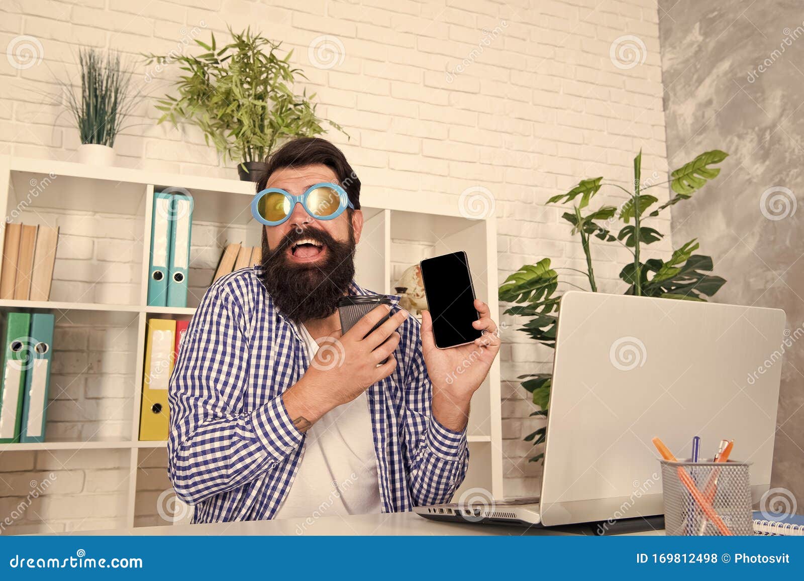 Crazy About Technology Bearded Man In Funky Glasses Using Smartphone