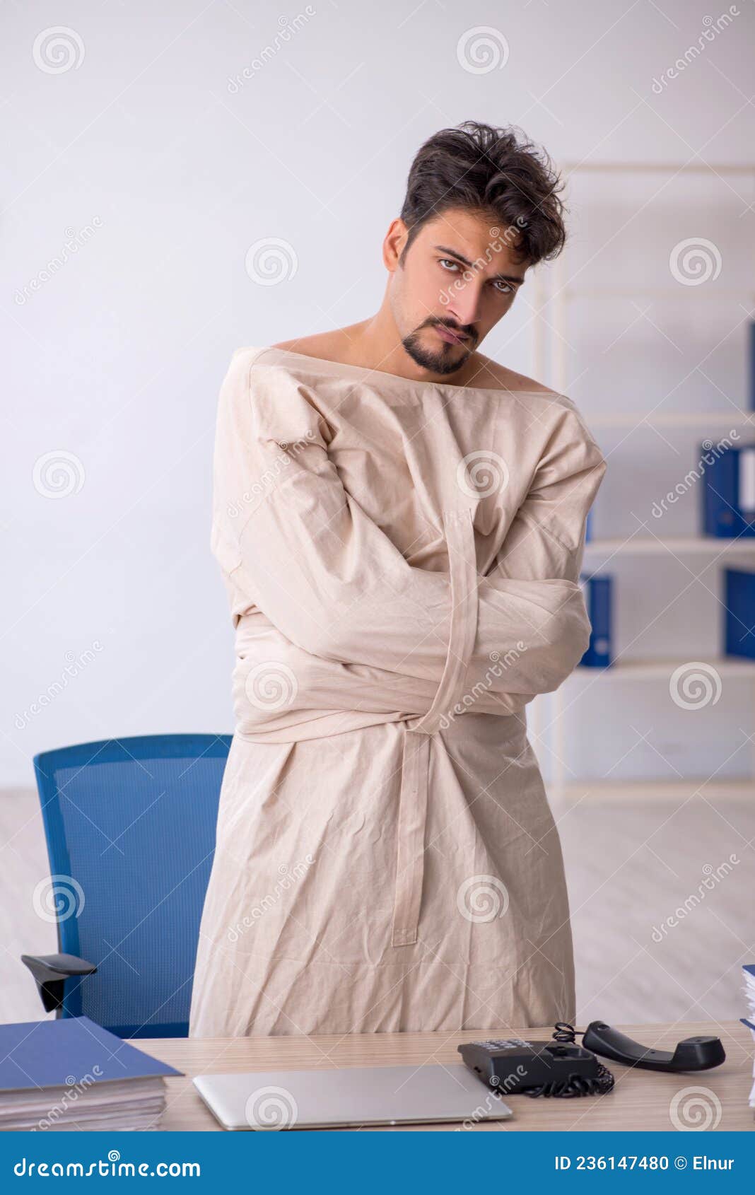 Crazy Young Man in Straitjacket at the Office Stock Photo - Image of ...