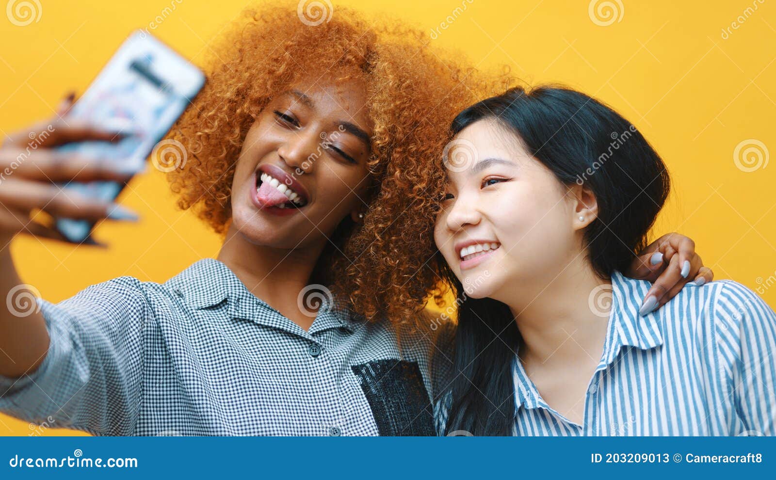 Crazy Young Multiracial Girl Friends Or Lesbian Couple Making Funny