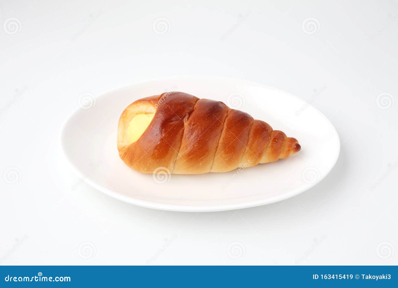 Cream Cornet Roll Bread on Plate Isolated on White Background Stock ...