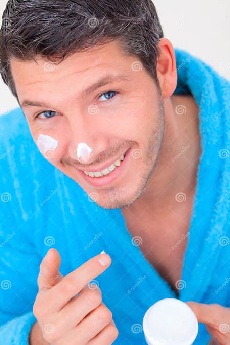 Cream cosmetics man stock photo. Image of bathrobe, rejuvenate - 13318380