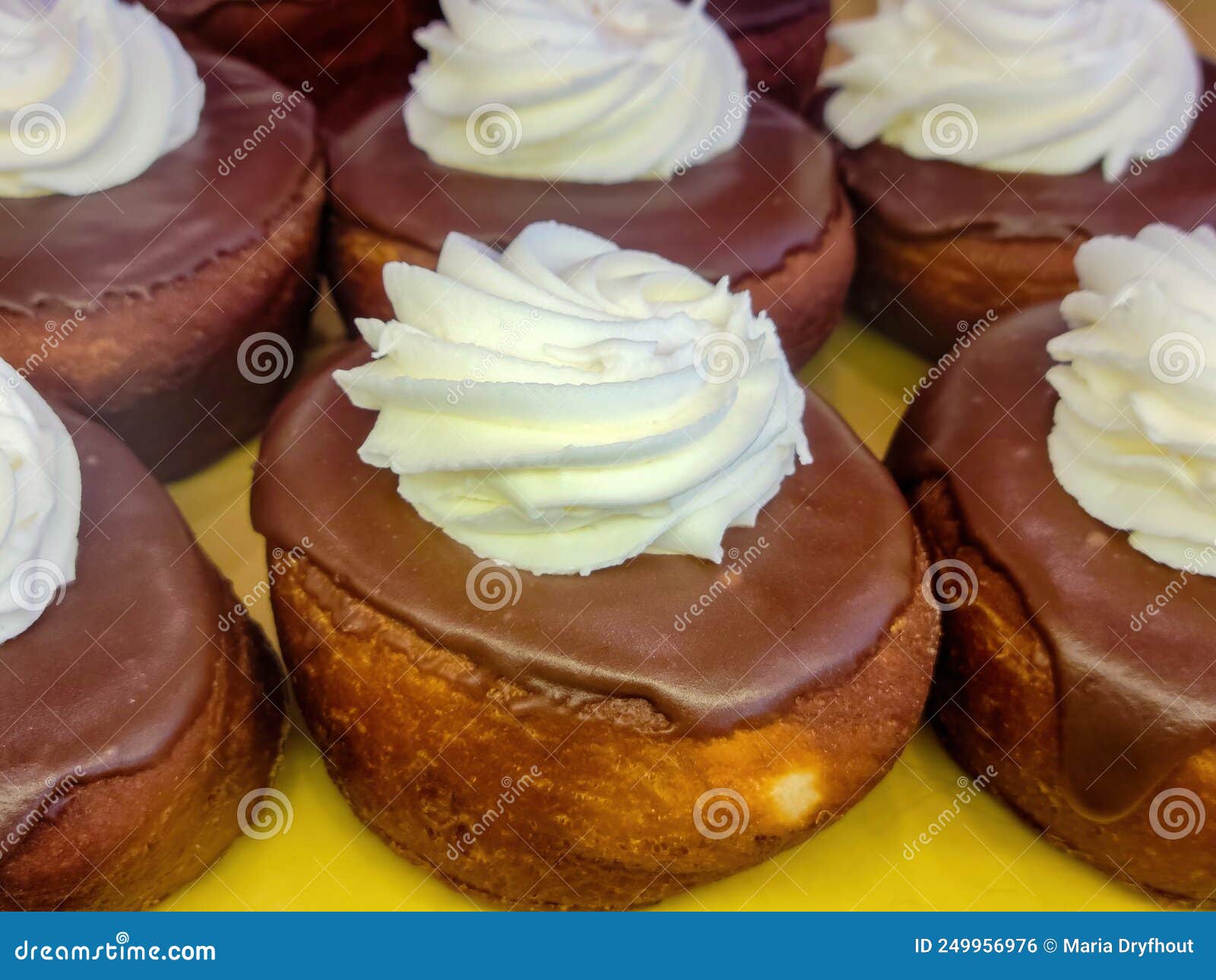 Cream Dollops on Chocolate Doughnuts Stock Photo - Image of icing ...