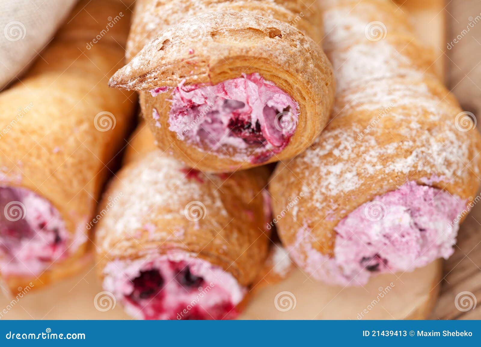 Cream-filled pastry roll stock image. Image of powdered - 21439413