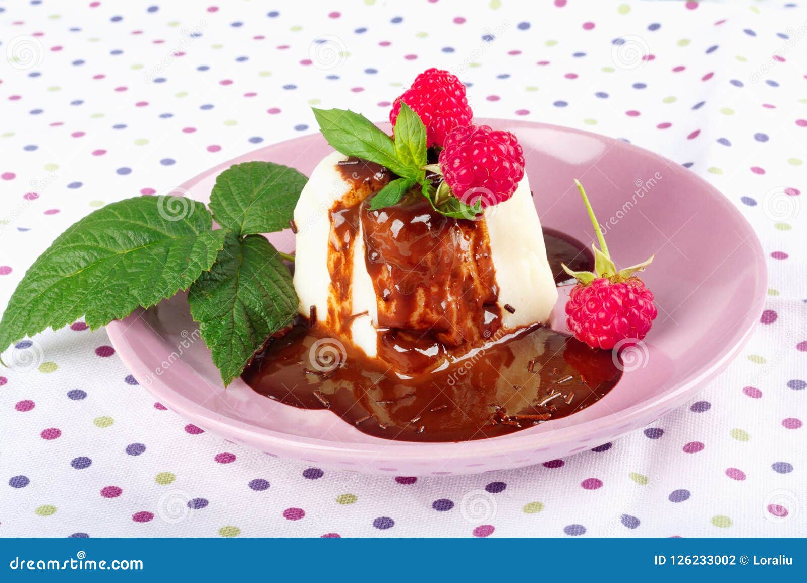 Cream Pudding with Chocolate Sauce, Raspberry and Mint on Table Stock ...
