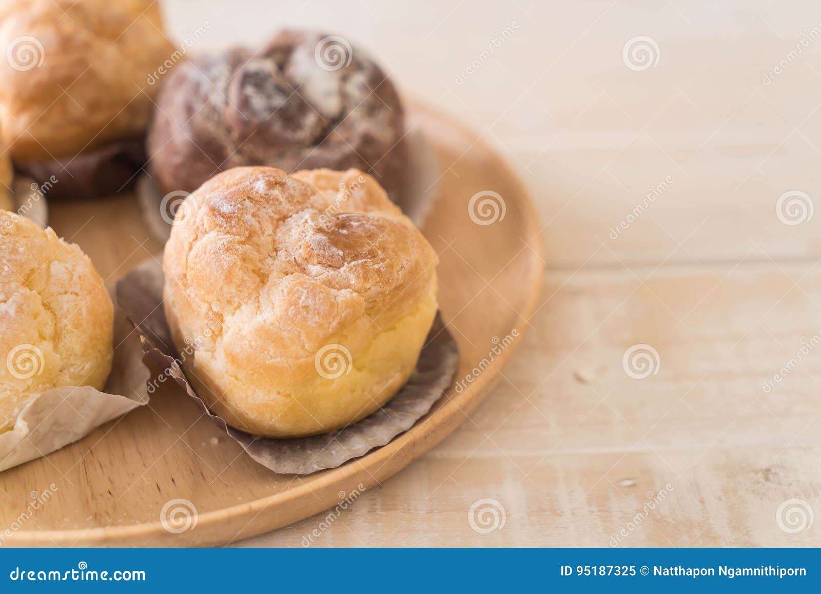 Cream puff on plate stock image. Image of cake, profiterole - 95187325