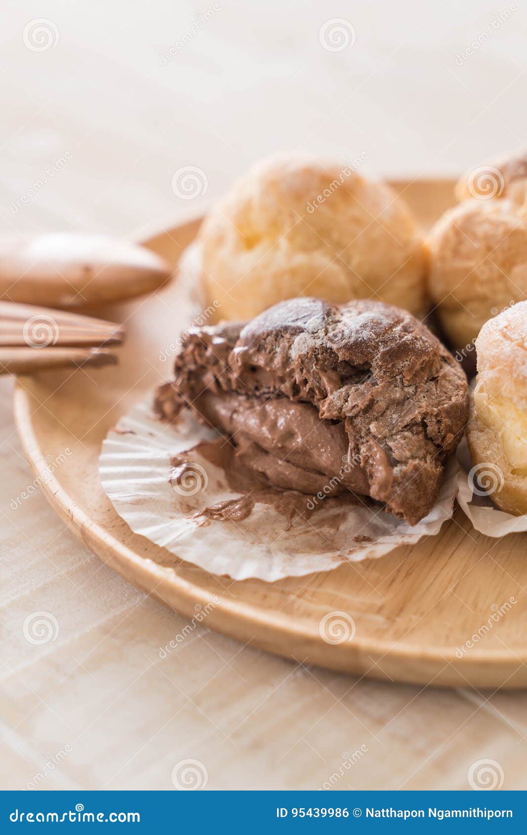 Cream puff on plate stock photo. Image of gourmet, snack - 95439986