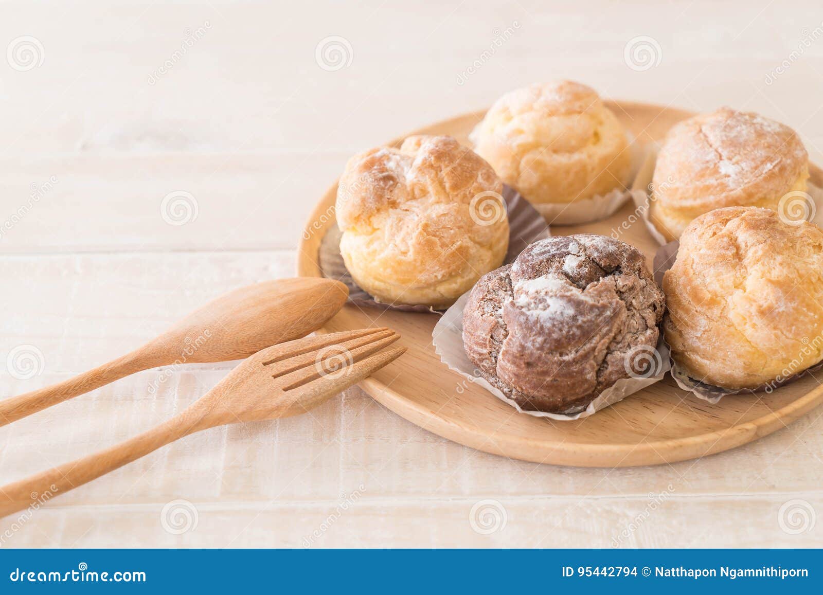 Cream puff on plate stock photo. Image of dessert, baked - 95442794