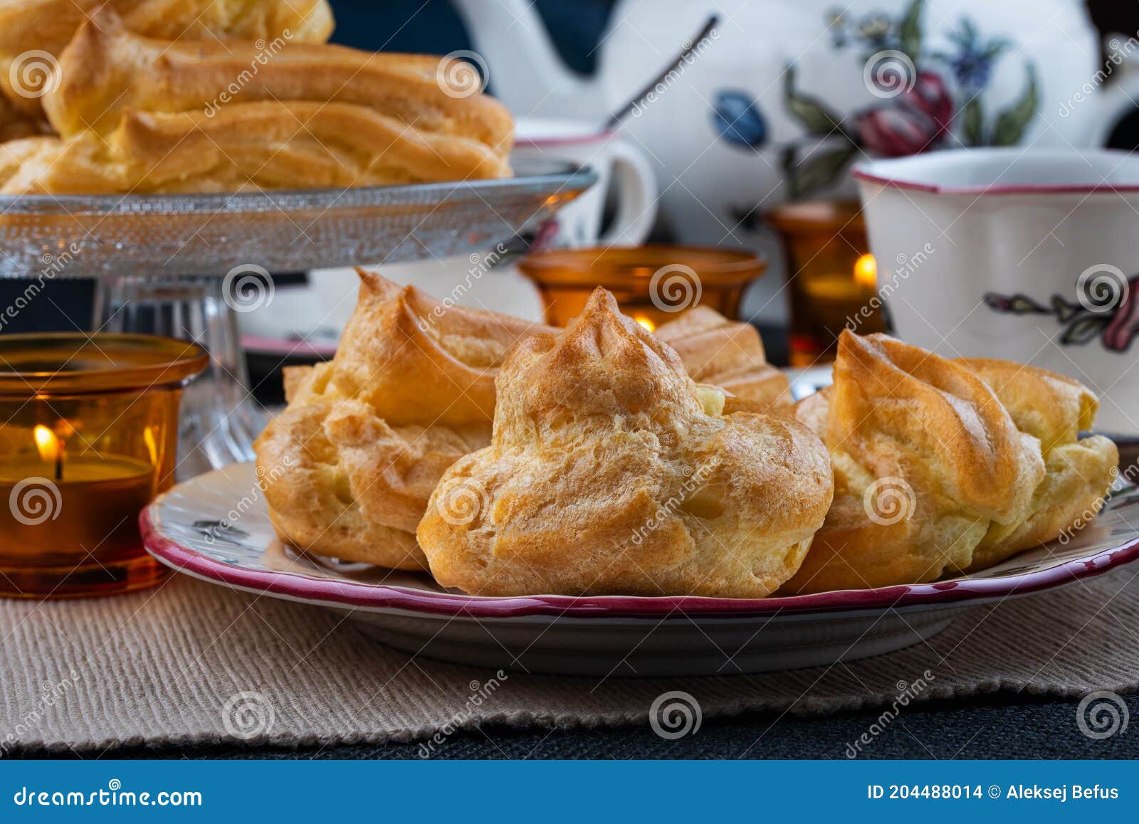 Cream puff on a plate stock photo. Image of homemade - 204488014