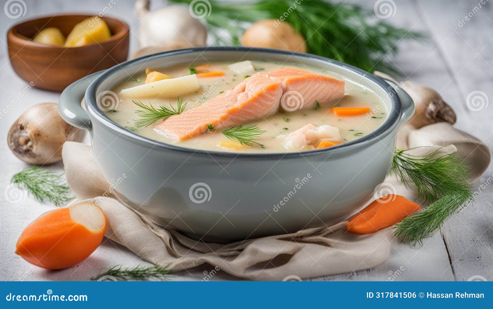 Creamy Fish Soup With Aromatic Herbs In A White Bowl On A Table ...