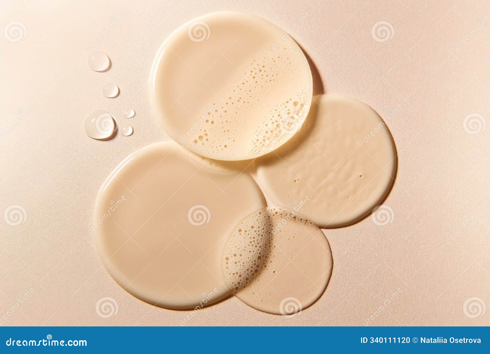Creamy Liquid Drops with Smooth Texture on a Light Beige Surface ...