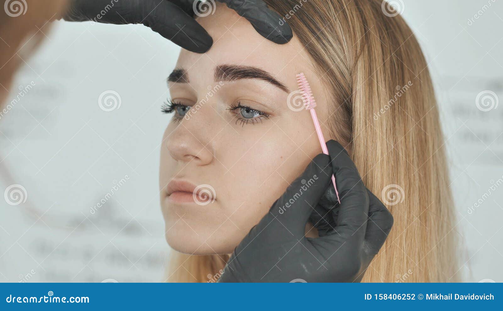 Create Permanent Eyebrow Makeup. Combing Eyebrows after Dyeing. Stock ...