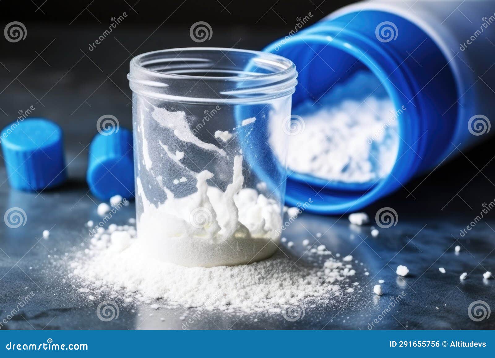 Creatine Powder Spilled from Blue Container on Granite Surface Stock ...