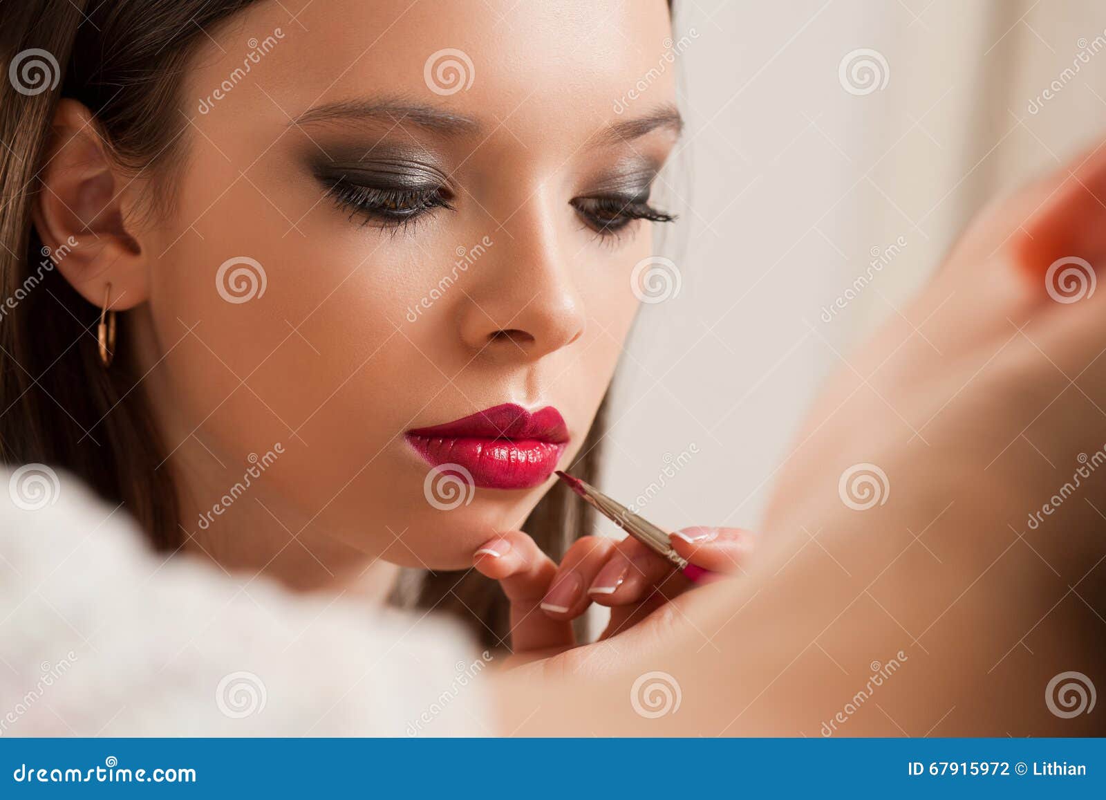 Creating beautiful makeup. stock photo. Image of lipstick - 67915972