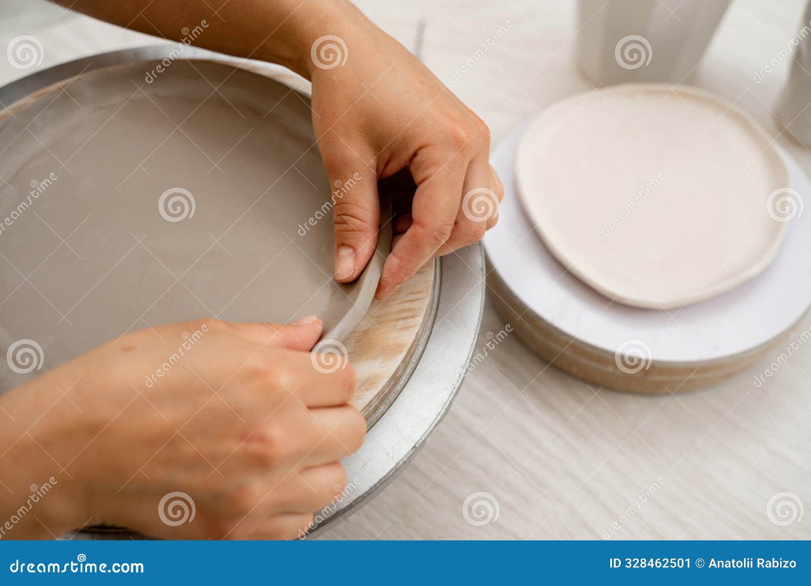 Creating Ceramic Products from Flat Sheets of Clay. Using Hands To ...