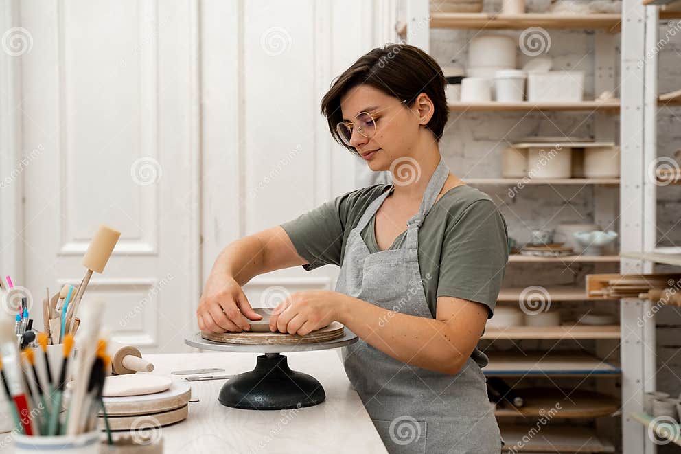 Creating Ceramic Products from Flat Sheets of Clay. Using Hands To ...