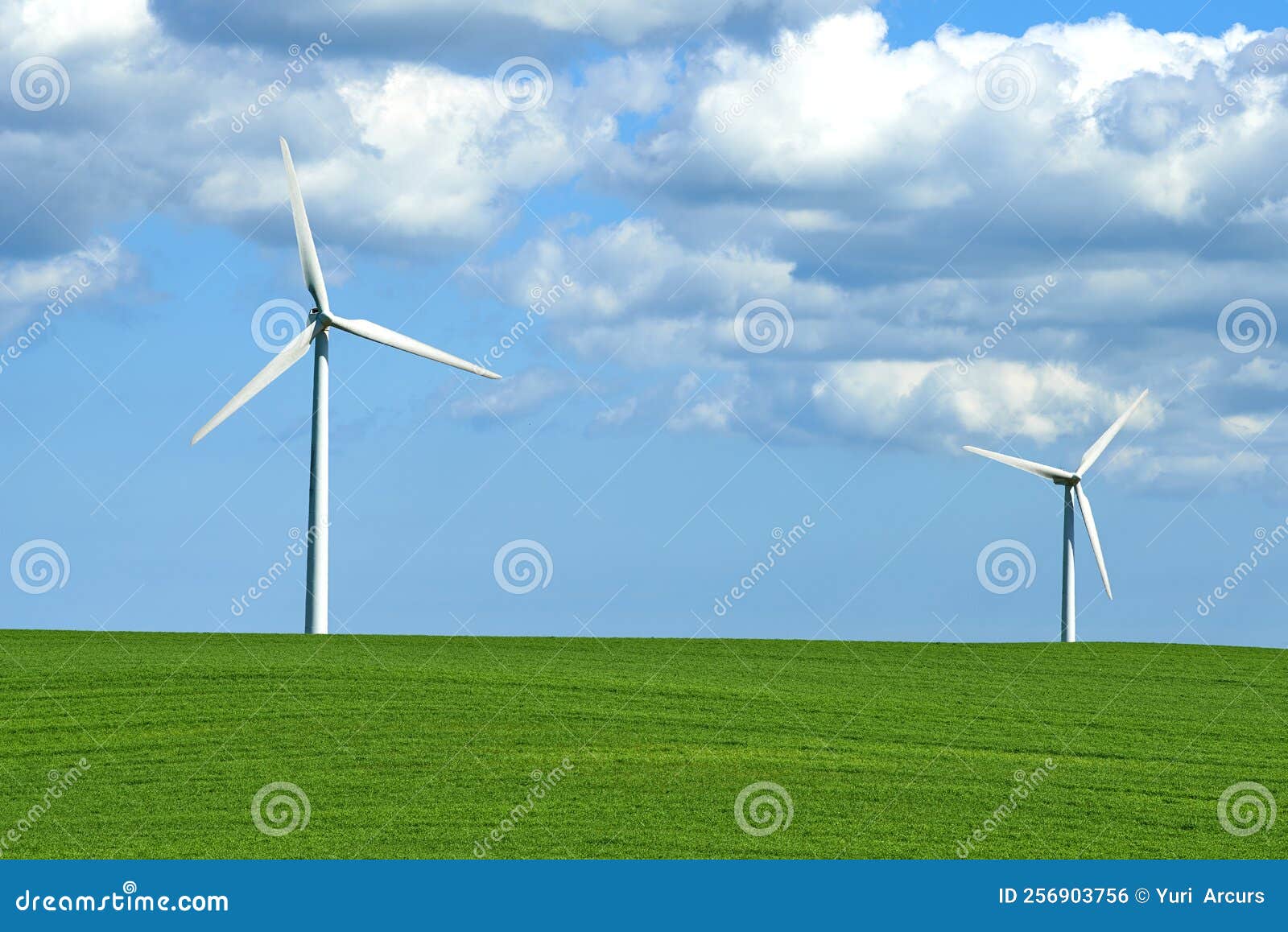 Creating Energy with the Wind. Wind Turbines on a Grassy Field. Stock ...