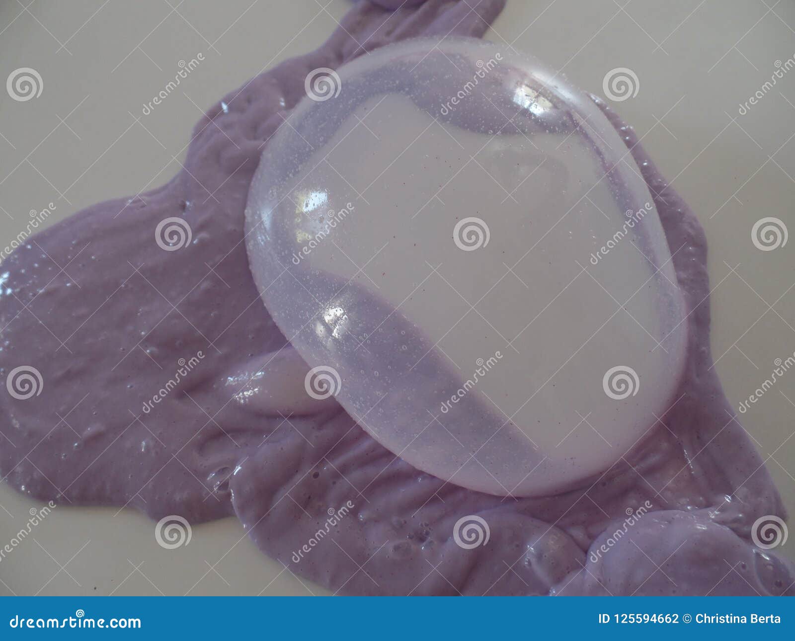 Creating a Giant Bubble from Stretchy Lilac Coloured Slime Stock Photo ...