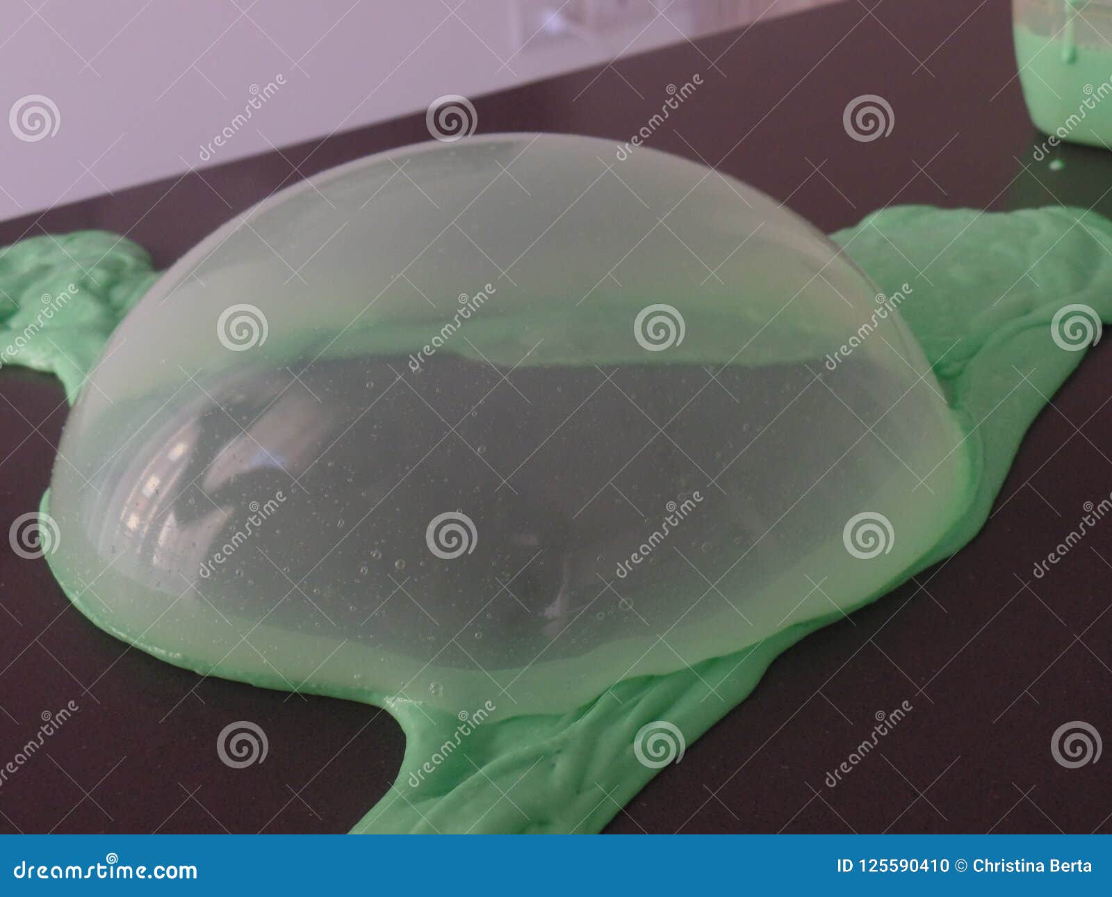 Creating a Large Bubble from Bright Green Slime Stock Photo - Image of ...