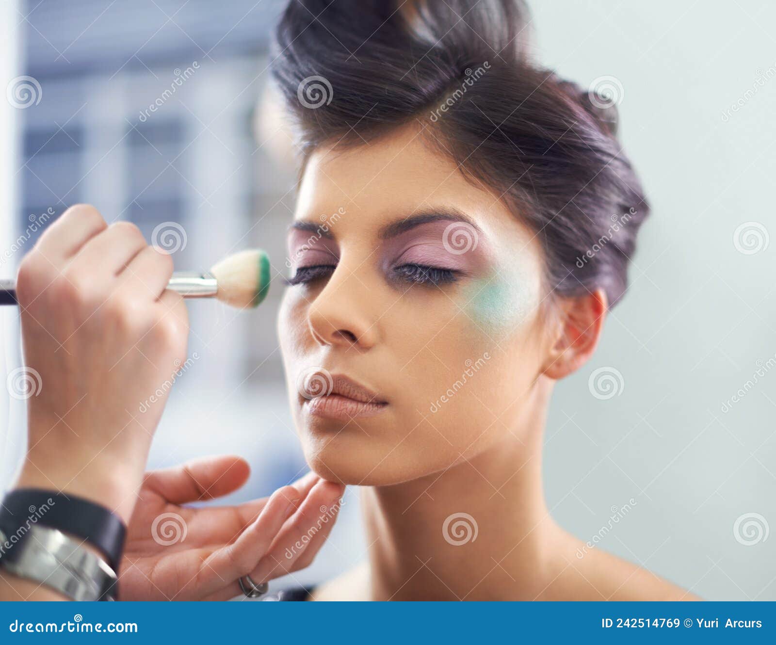 Creating a Masterpiece. a Young Woman Having Makeup Applied. Stock ...