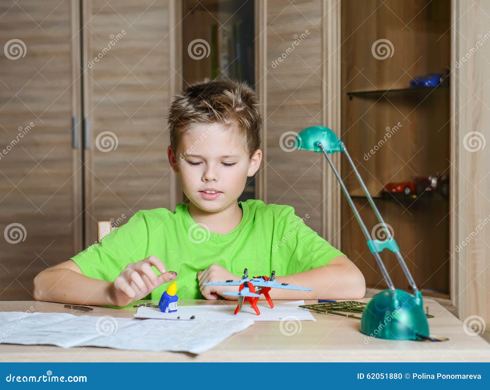Creating the Model Plane. Happy Boy Making Aircraft Model. Hobby ...