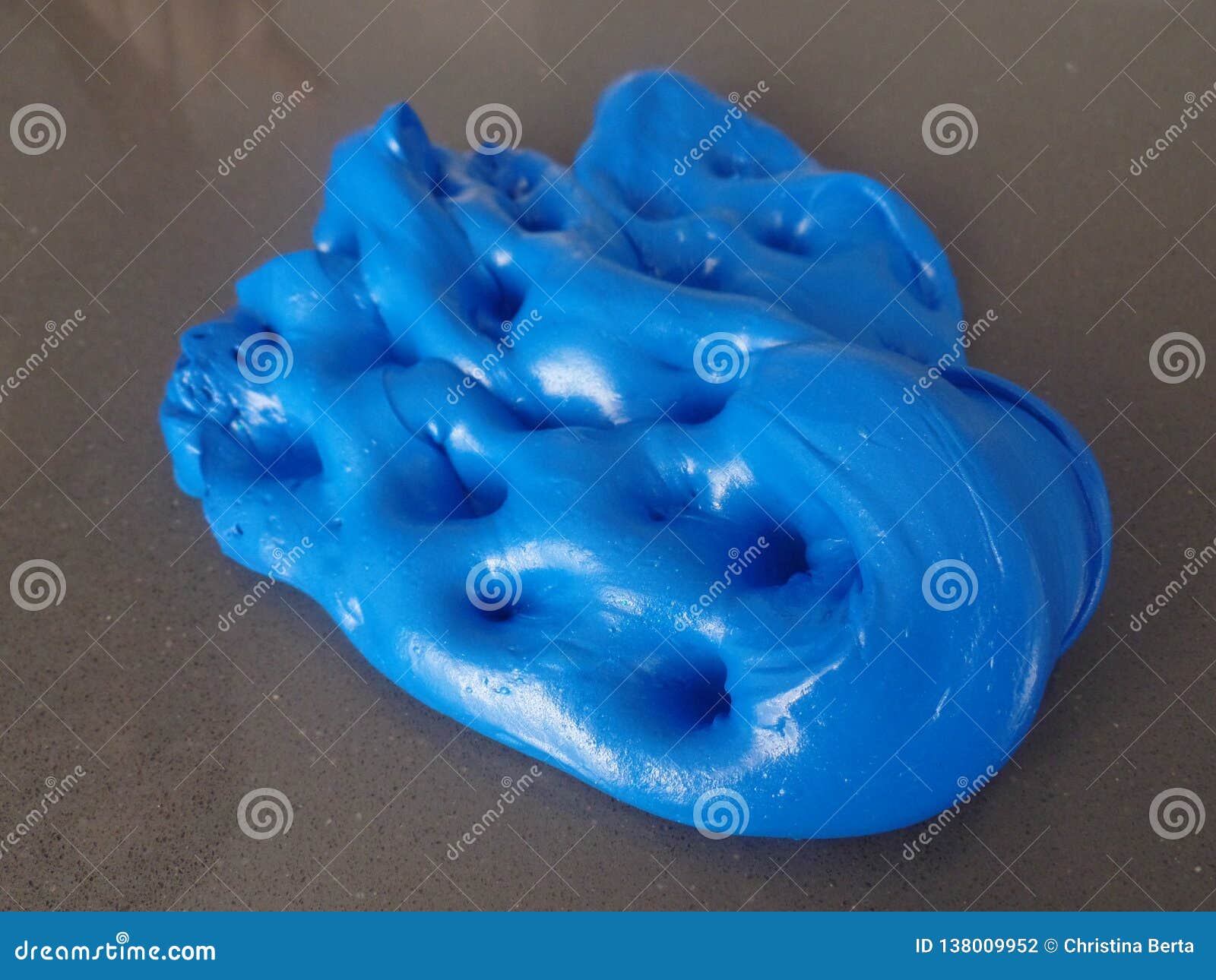 Creating Patterns with Blue Slime Stock Photo - Image of obsession ...