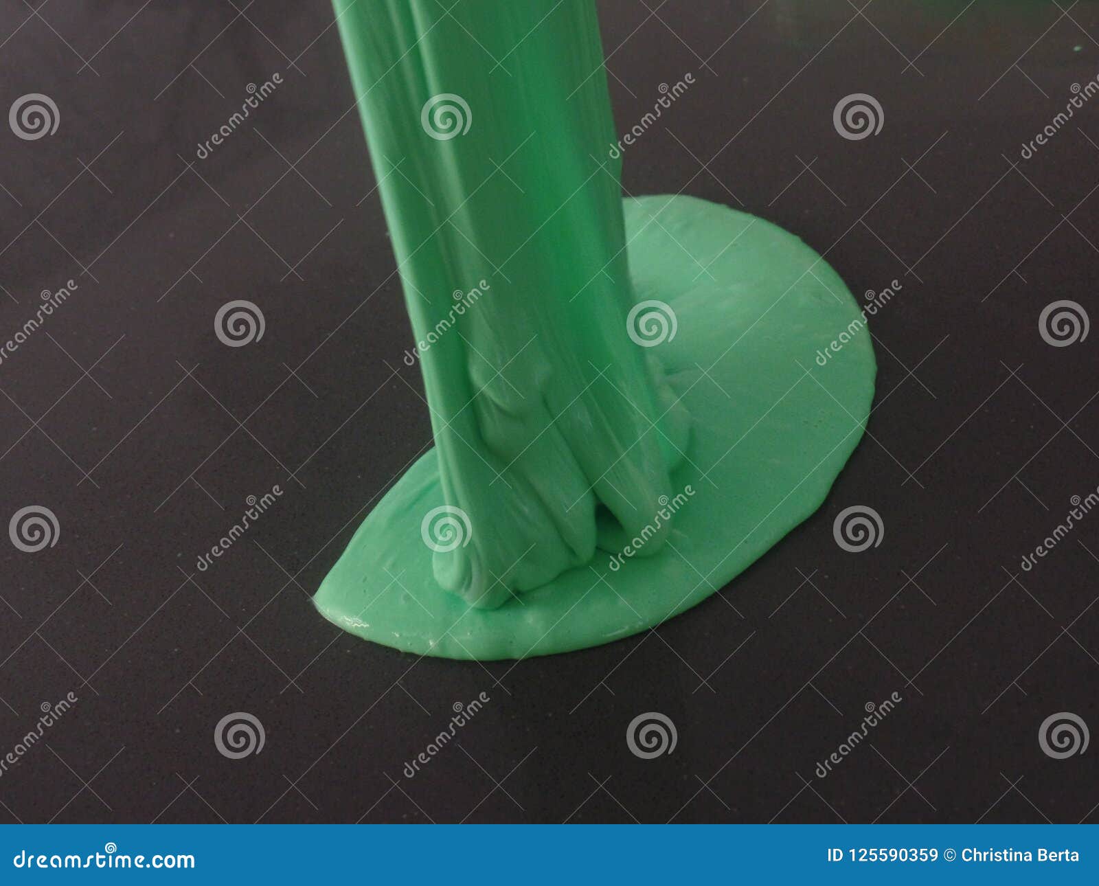 Creating Patterns Out of Bright Green Slime Stock Image - Image of dark ...