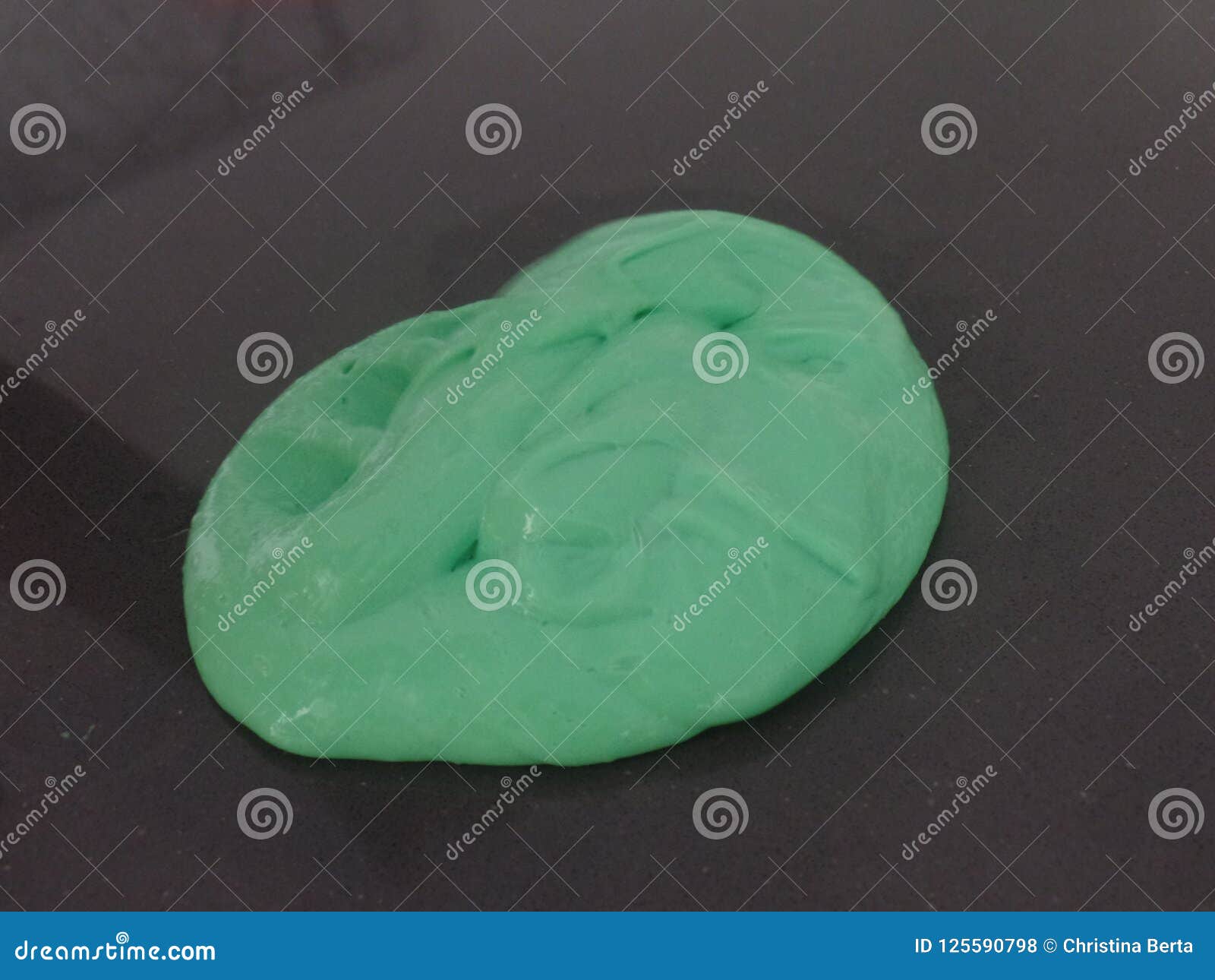Creating Patterns Out of Bright Green Slime Stock Photo - Image of ...